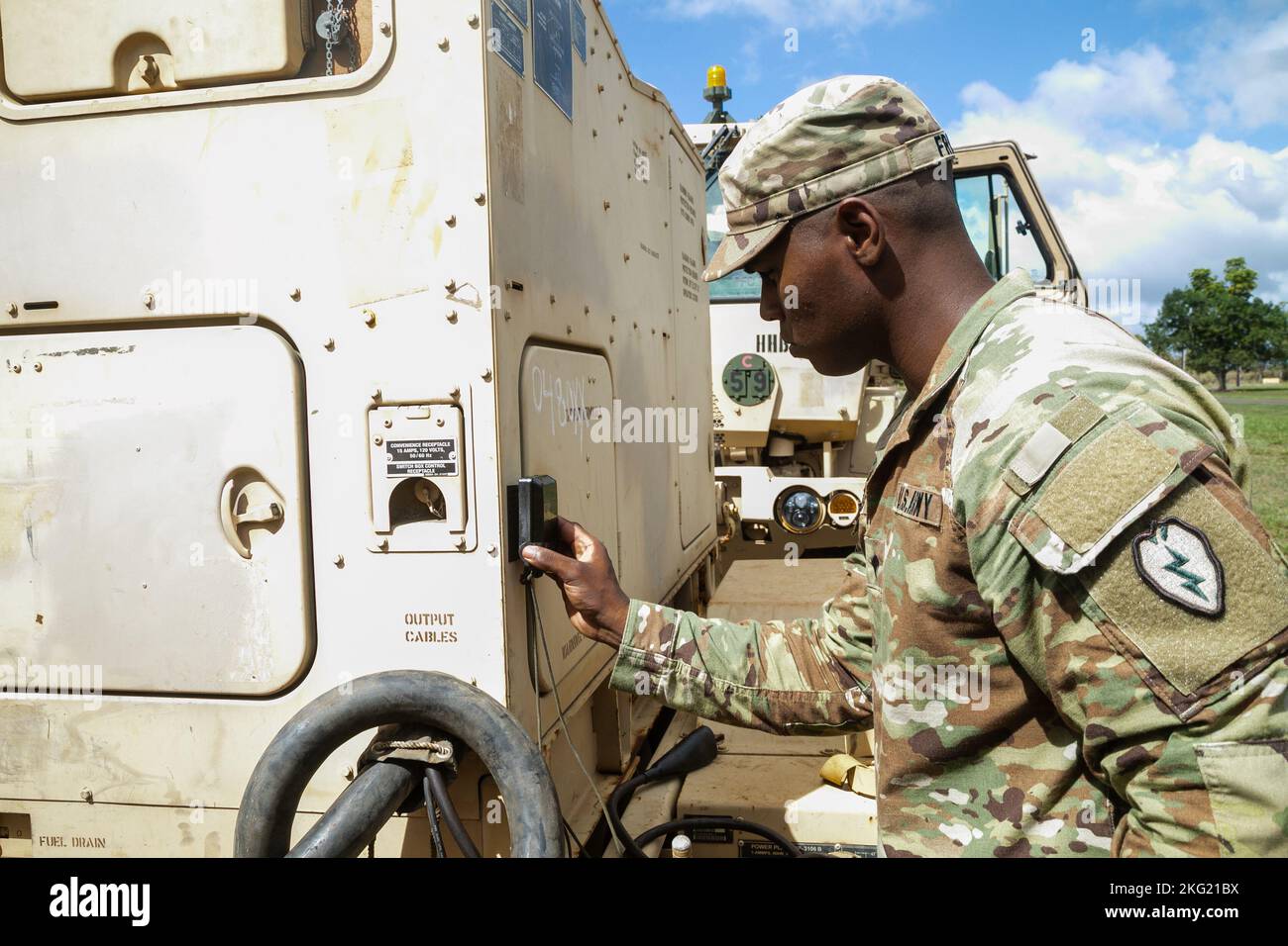 Civilian technicians assist Soldiers assigned to 2nd Battalion, 11th ...
