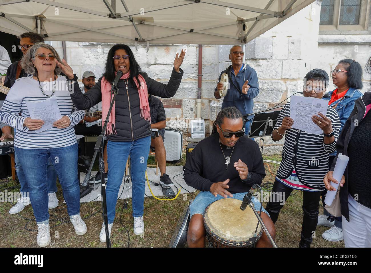 Mass outside Holy Trinity church, Pinterville, France. Mauritian ...