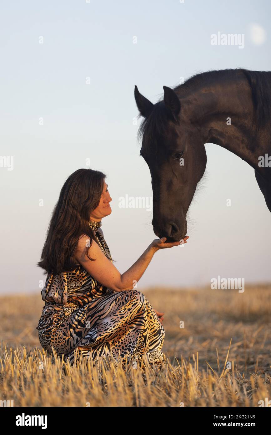 Woman feeds friend hi-res stock photography and images - Alamy