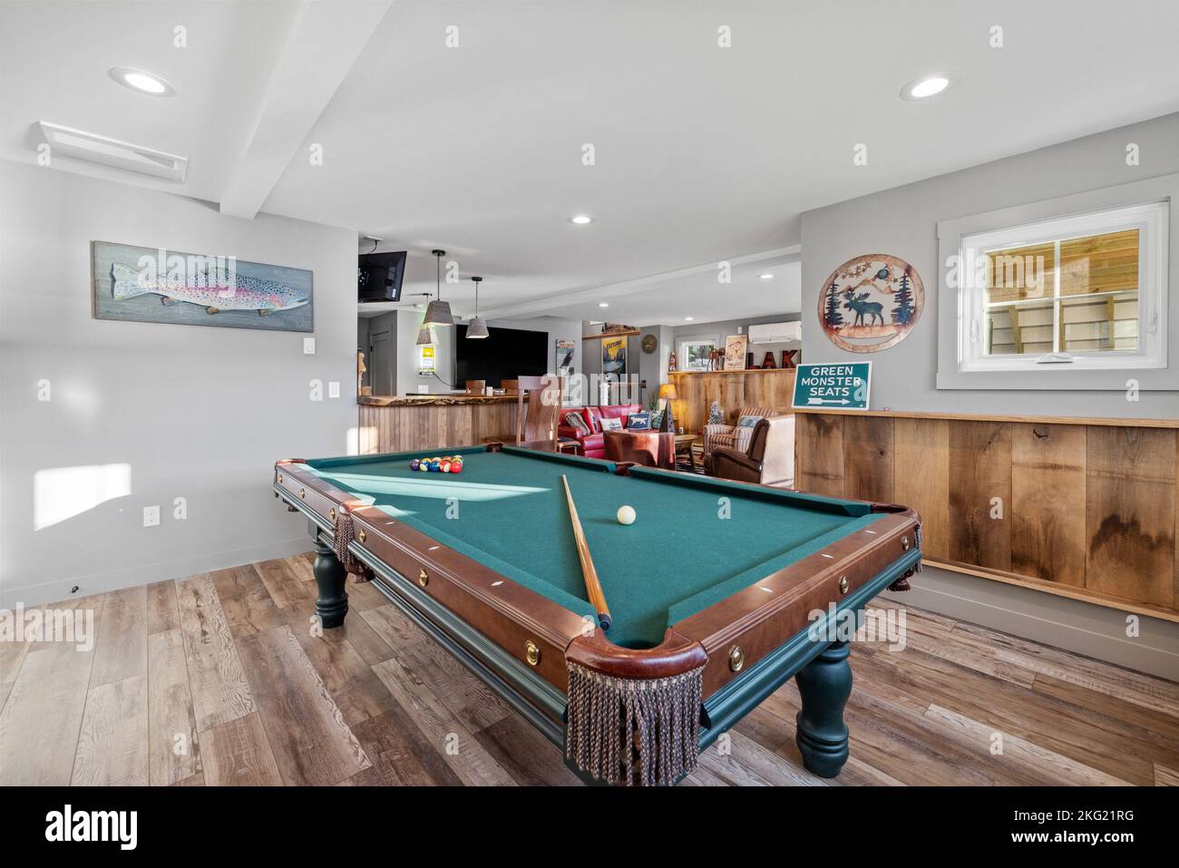 The beautiful interior of a cafe with a billiard table and white ...