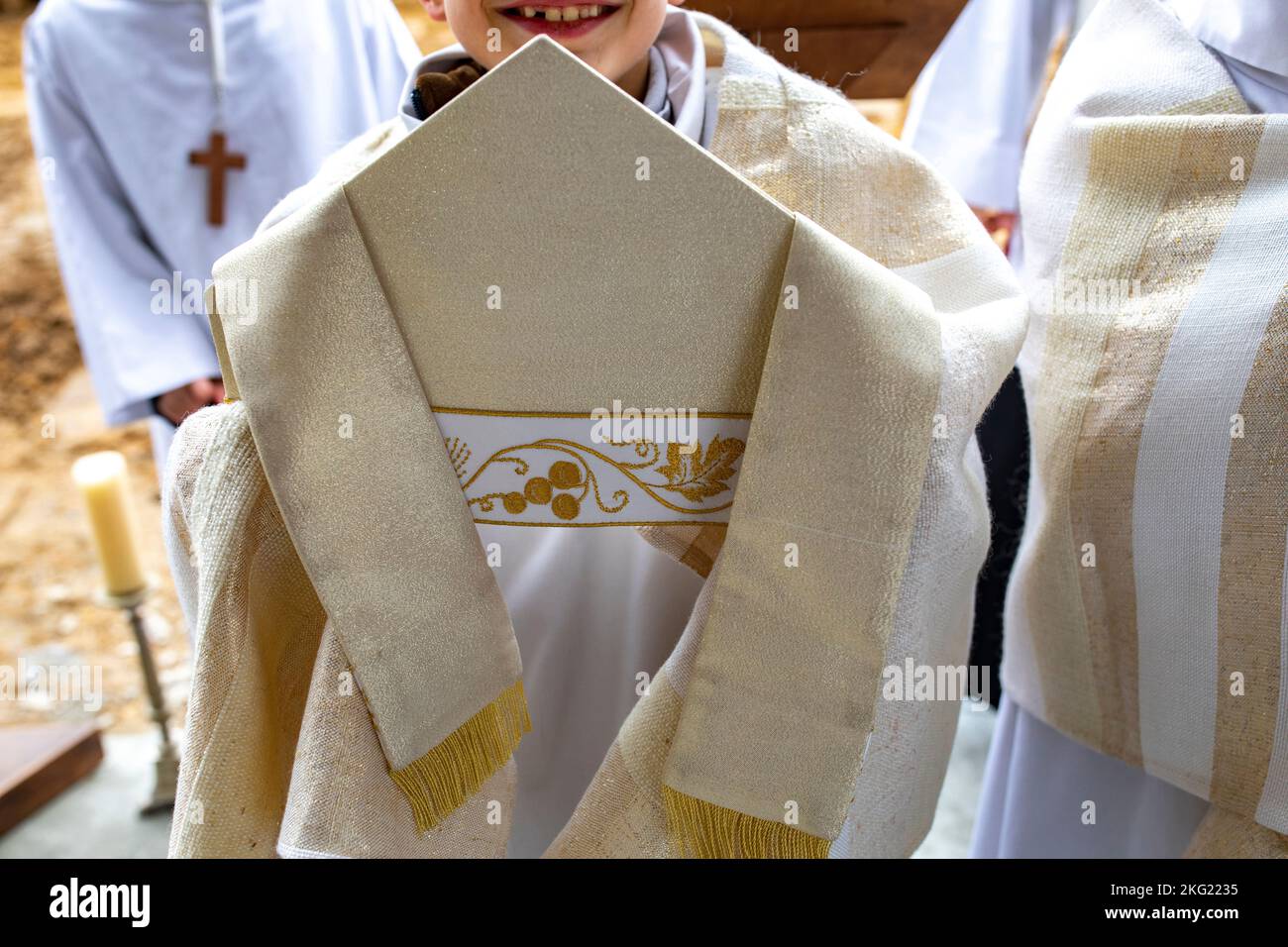 Altar boy holding a bishop's miter in Montigny-Voisins le Bretonneux ...
