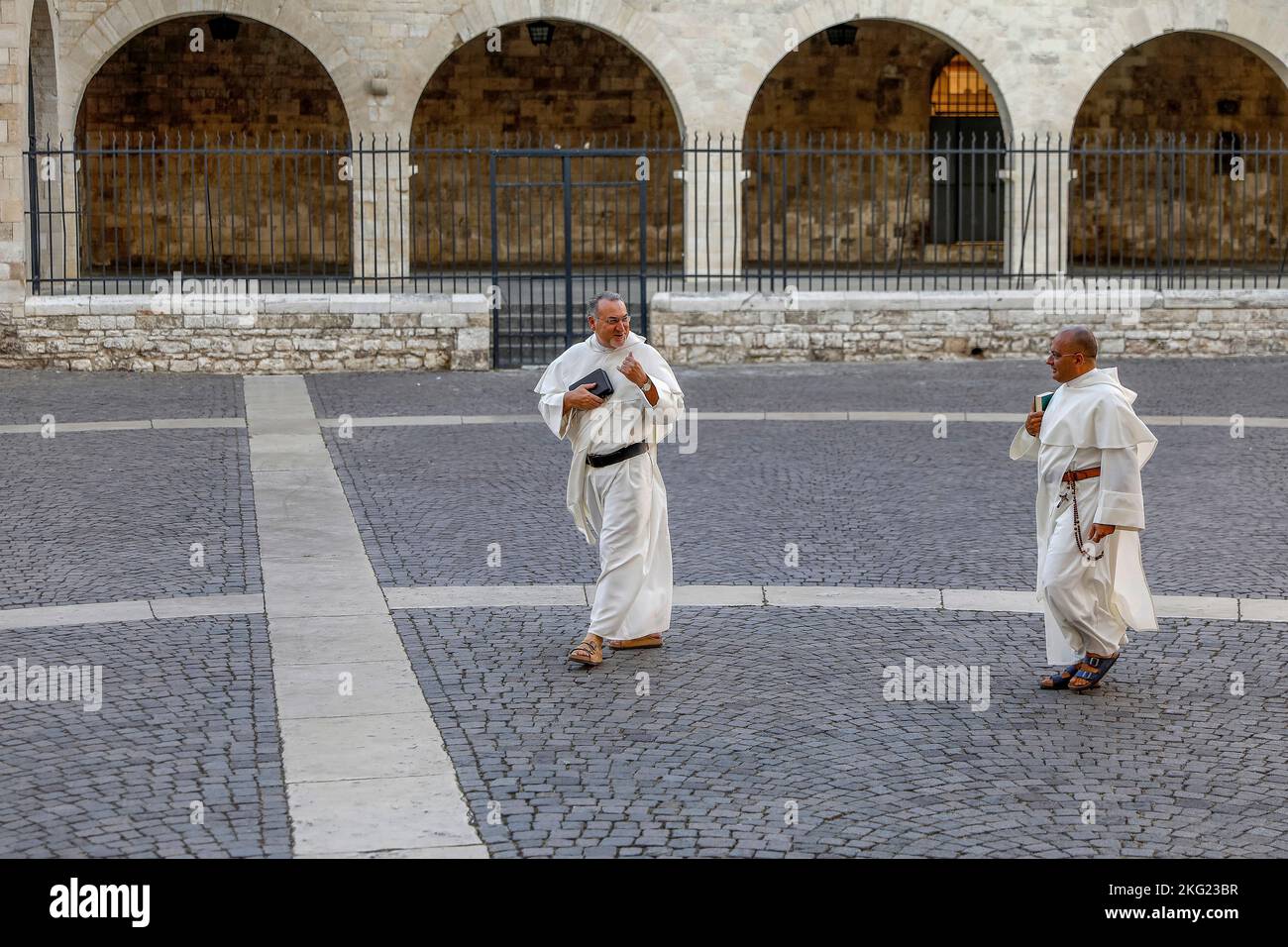 Dominican priests walking outside San Nicola's basilica in Bari, Italy ...