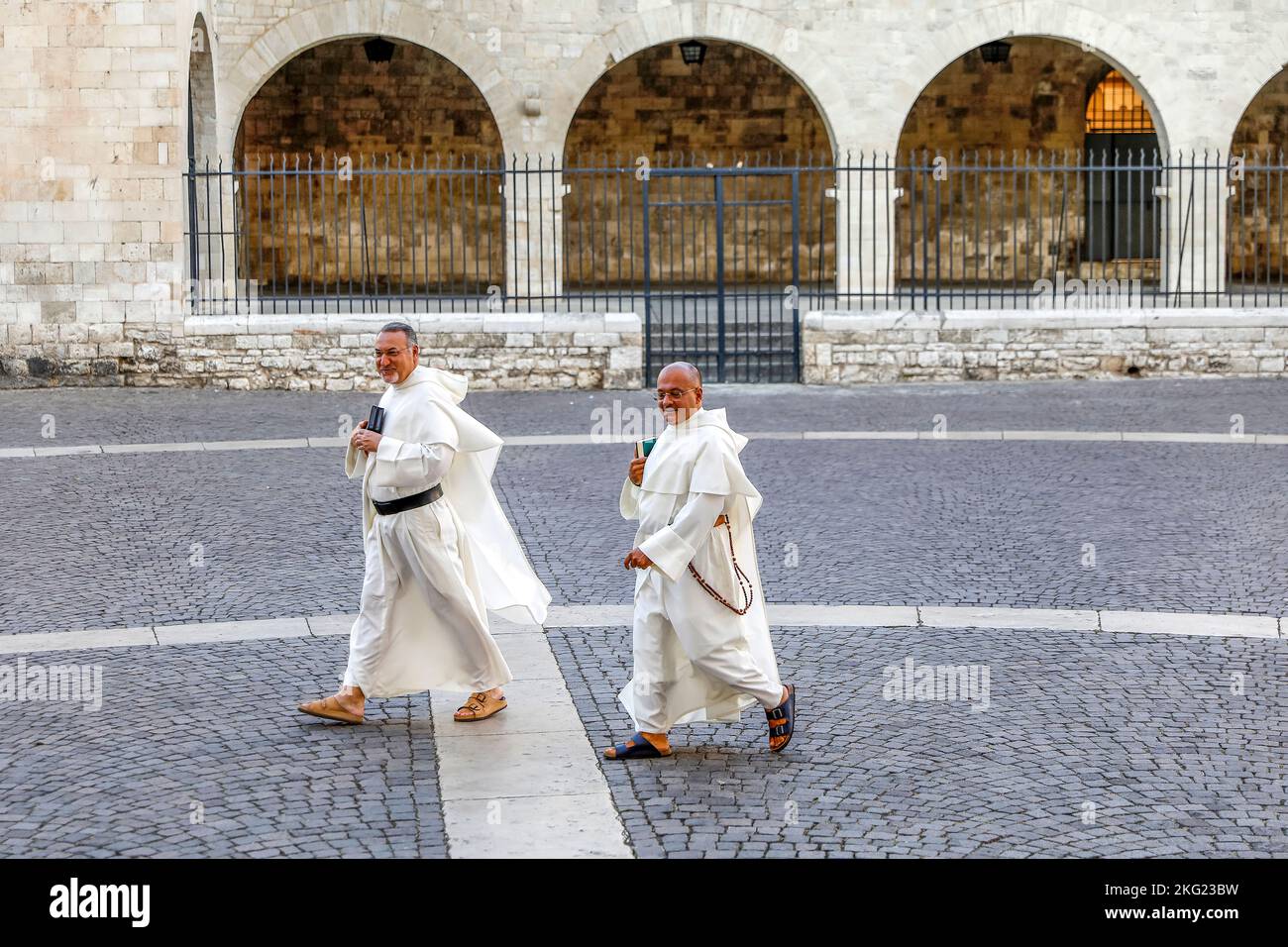 Dominican priest walking outside San Nicola's basilica in Bari, Italy ...