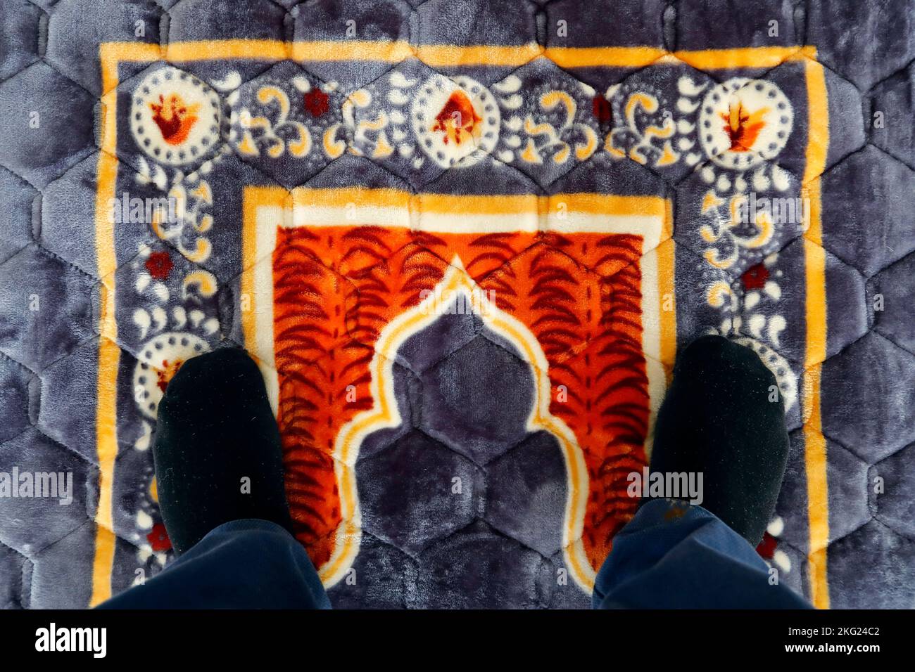 Al-Serkal Mosque. Muslim man praying on carpet in mosque. Phnom Penh ...