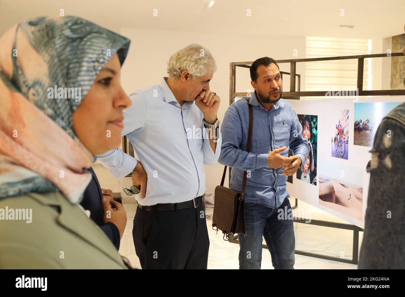 Misrata, Libya. 20th Nov, 2022. Visitors look at paintings and drawings ...
