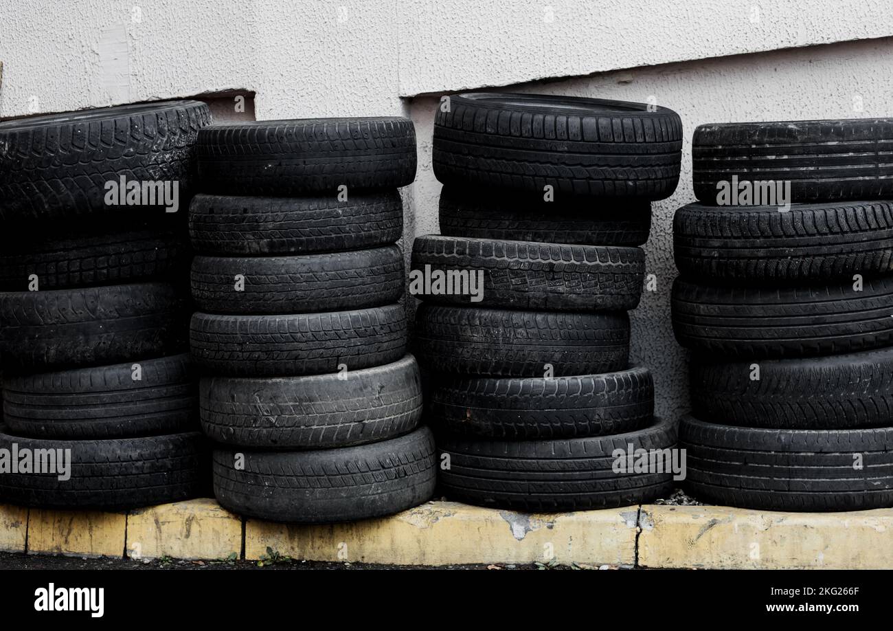 Stack of wheels black tyres outoors Stock Photo - Alamy