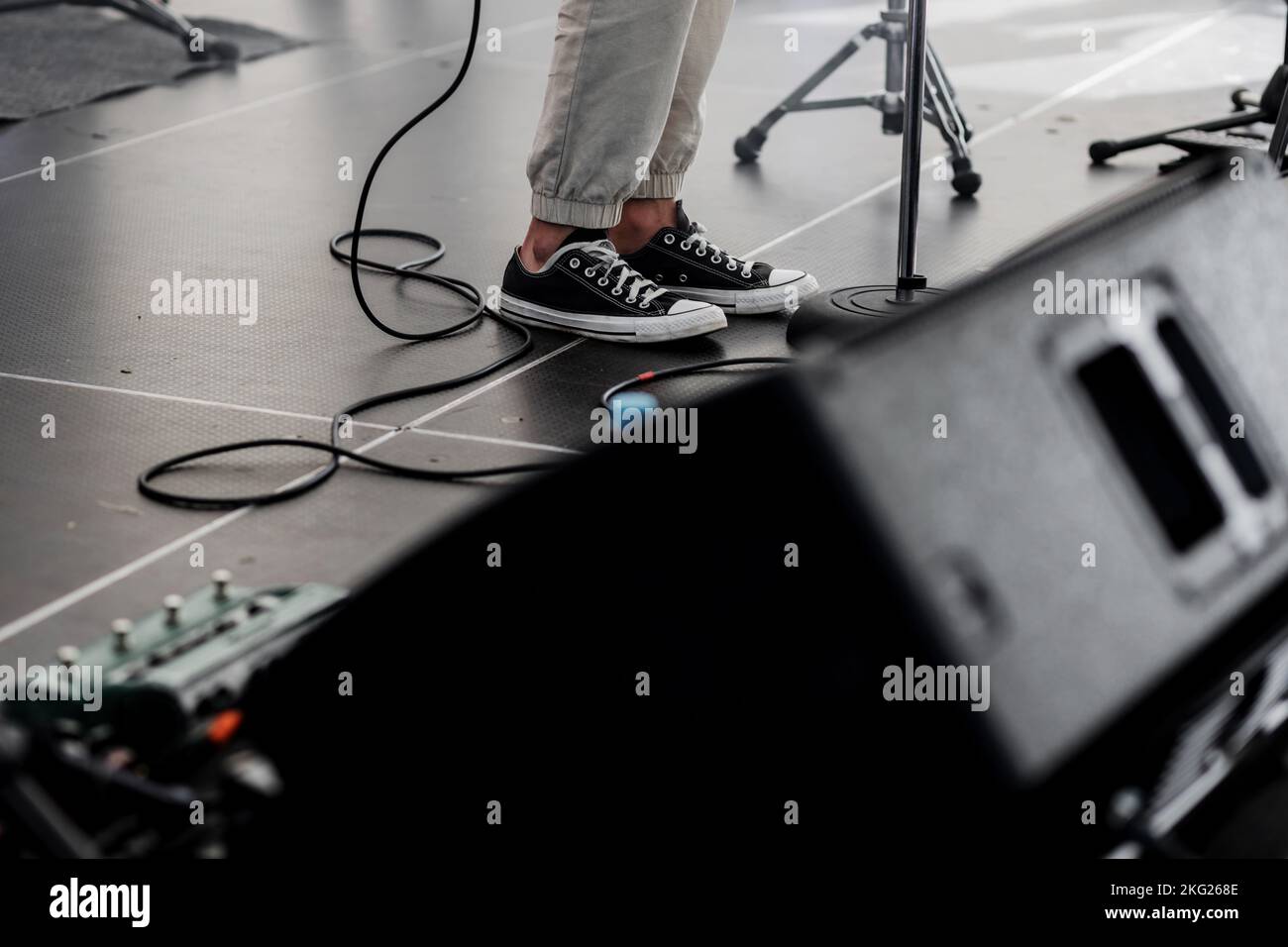 Rock star performing live on hard rock concert stage. focus on old ...