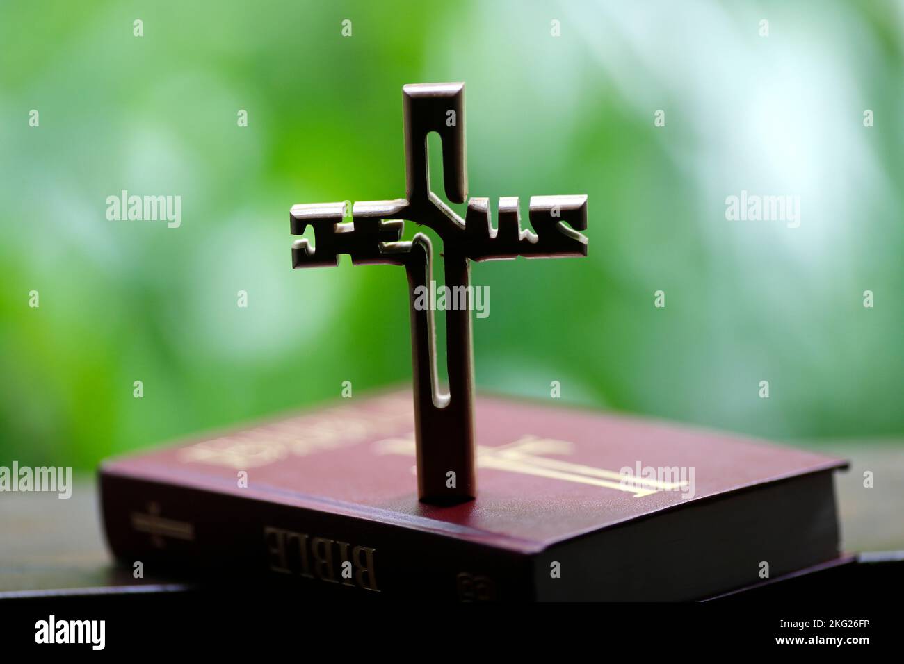 Holy bible and christian cross with the name of jesus. Faith and ...
