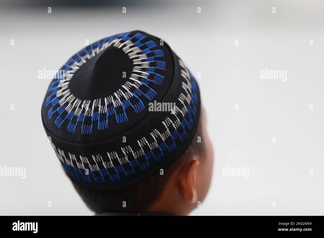 Muslim boy wearing a kufi. Friday prayer (salat) in mosque. Chau Doc ...