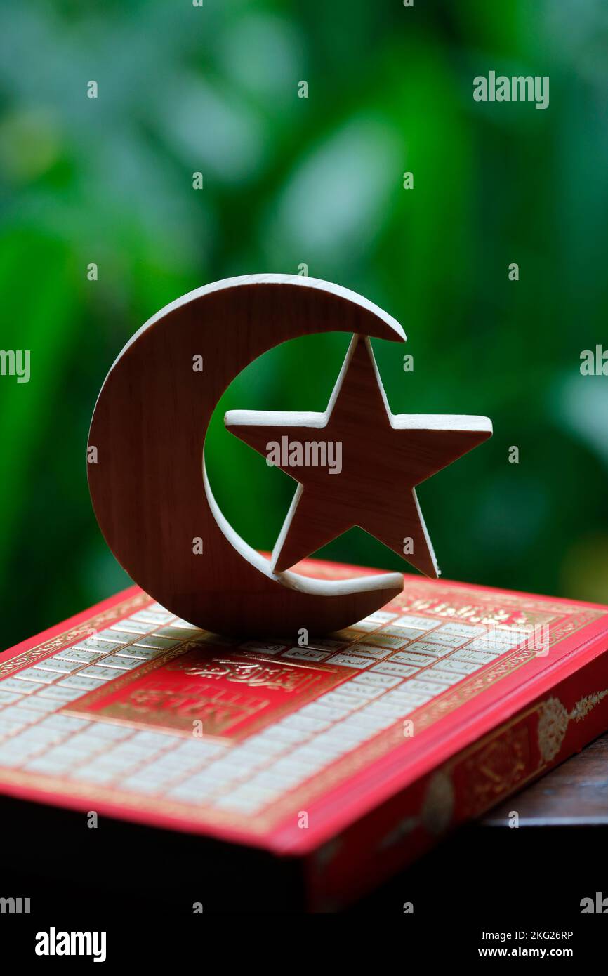 Holy Quran with islam crescent and star. Islamic symbol Stock Photo - Alamy