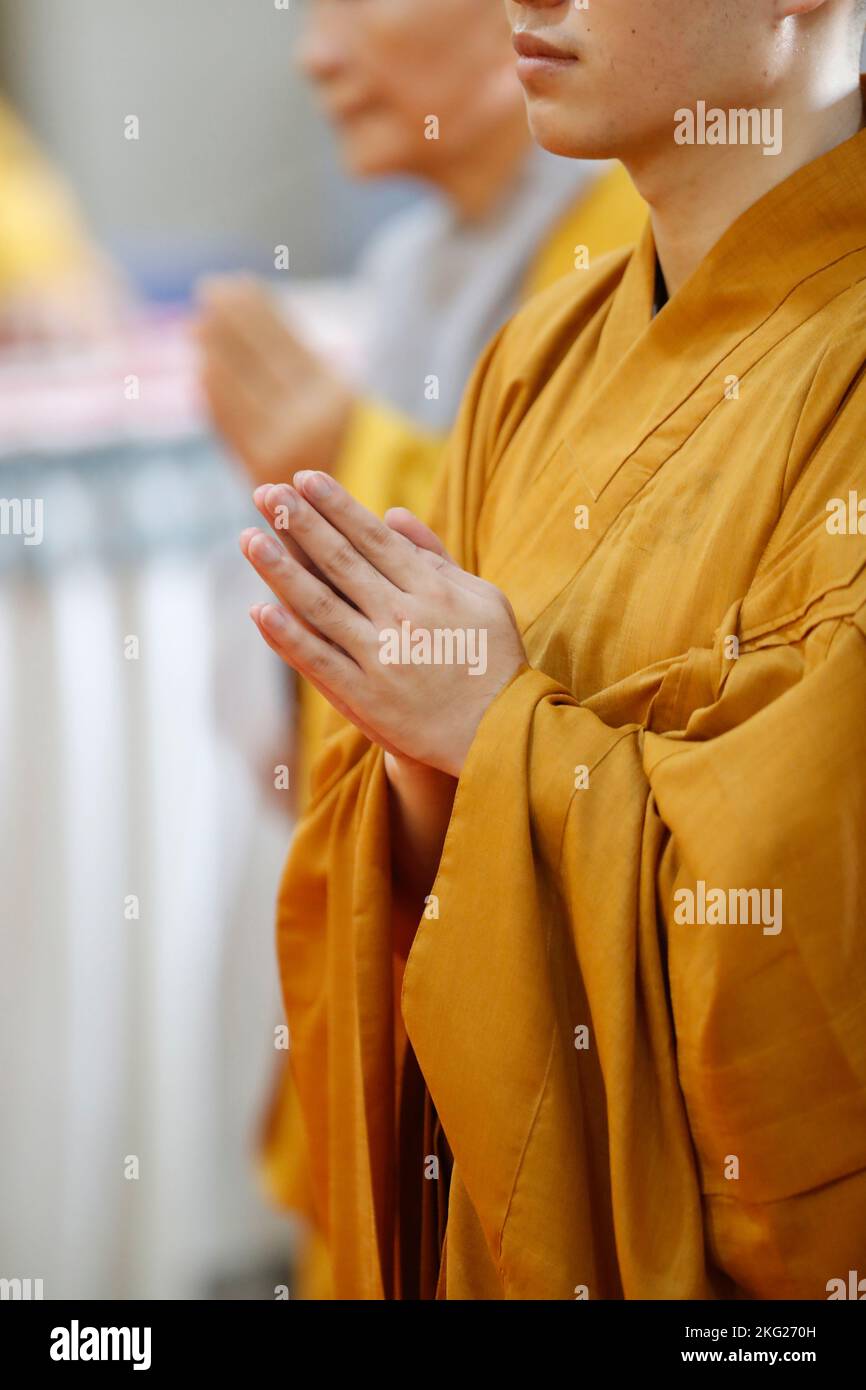 Phuoc Long buddhist temple. Buddhist ceremony. Monk praying. Close up ...