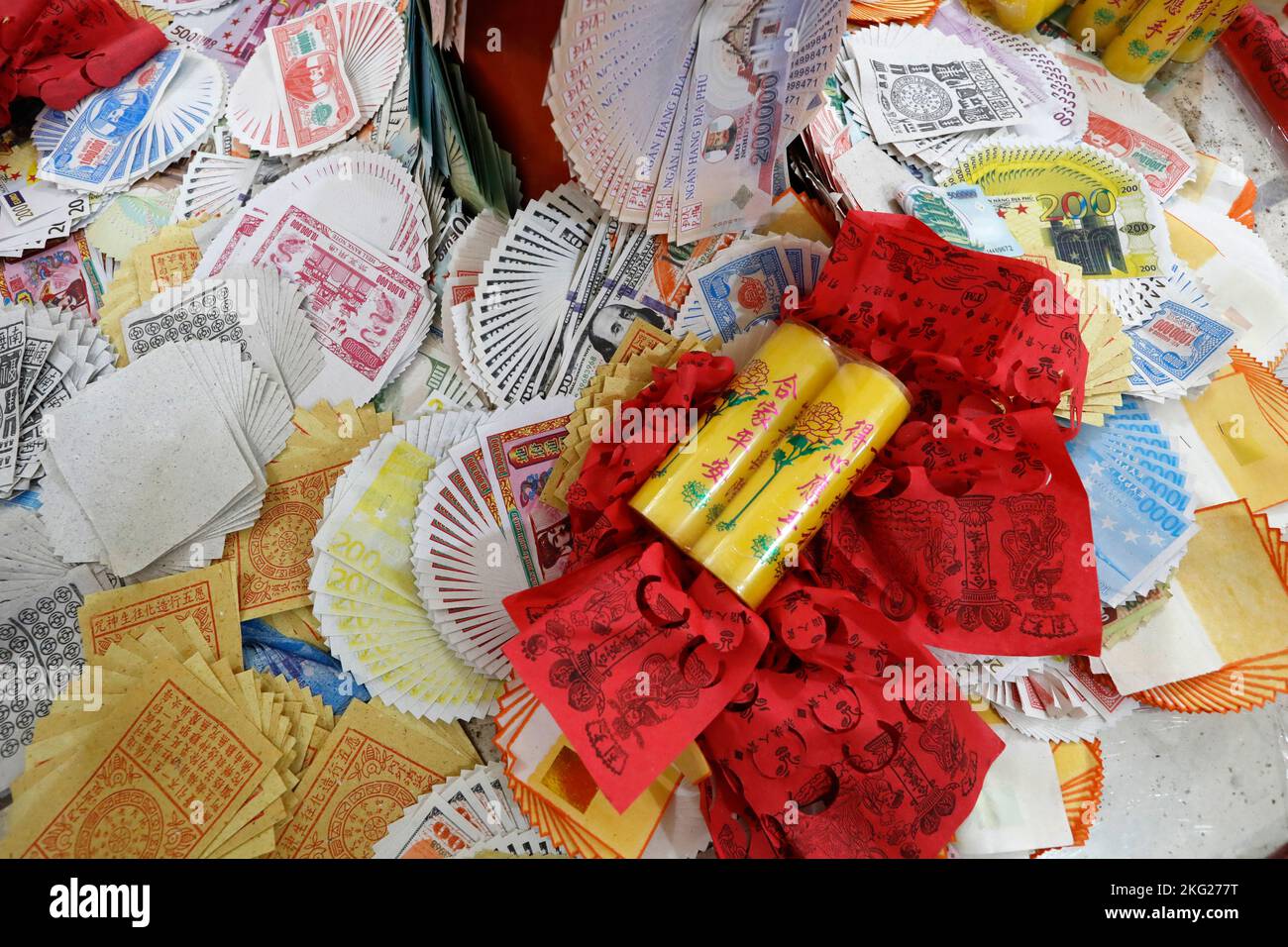 Phuoc Long buddhist temple. Burning hell bank notes and other forms of ...