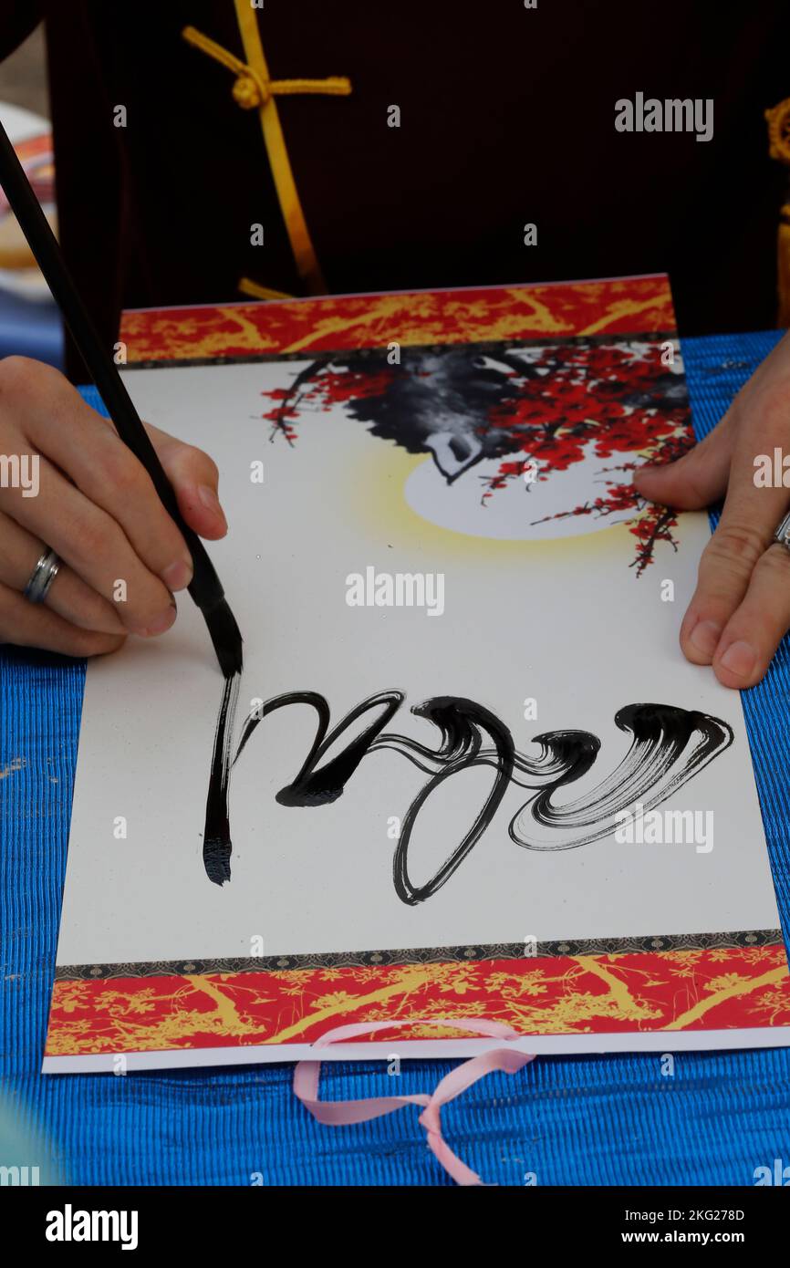 Phuoc Long buddhist temple. Calligraphy with black ink and brush. Tan ...