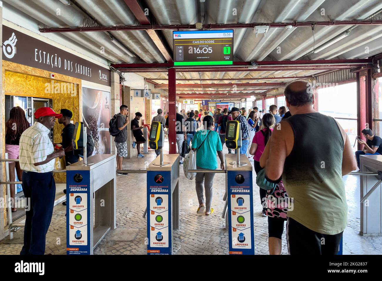 Queue of people embarking on boat at Cacilhas Stock Photo - Alamy