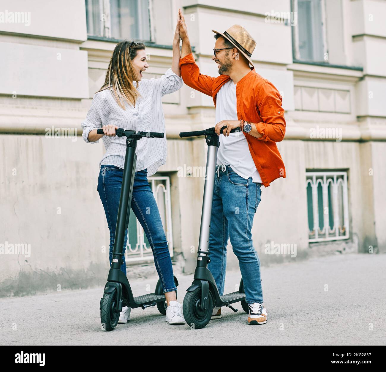 couple young electric scooter city transport riding technology ...