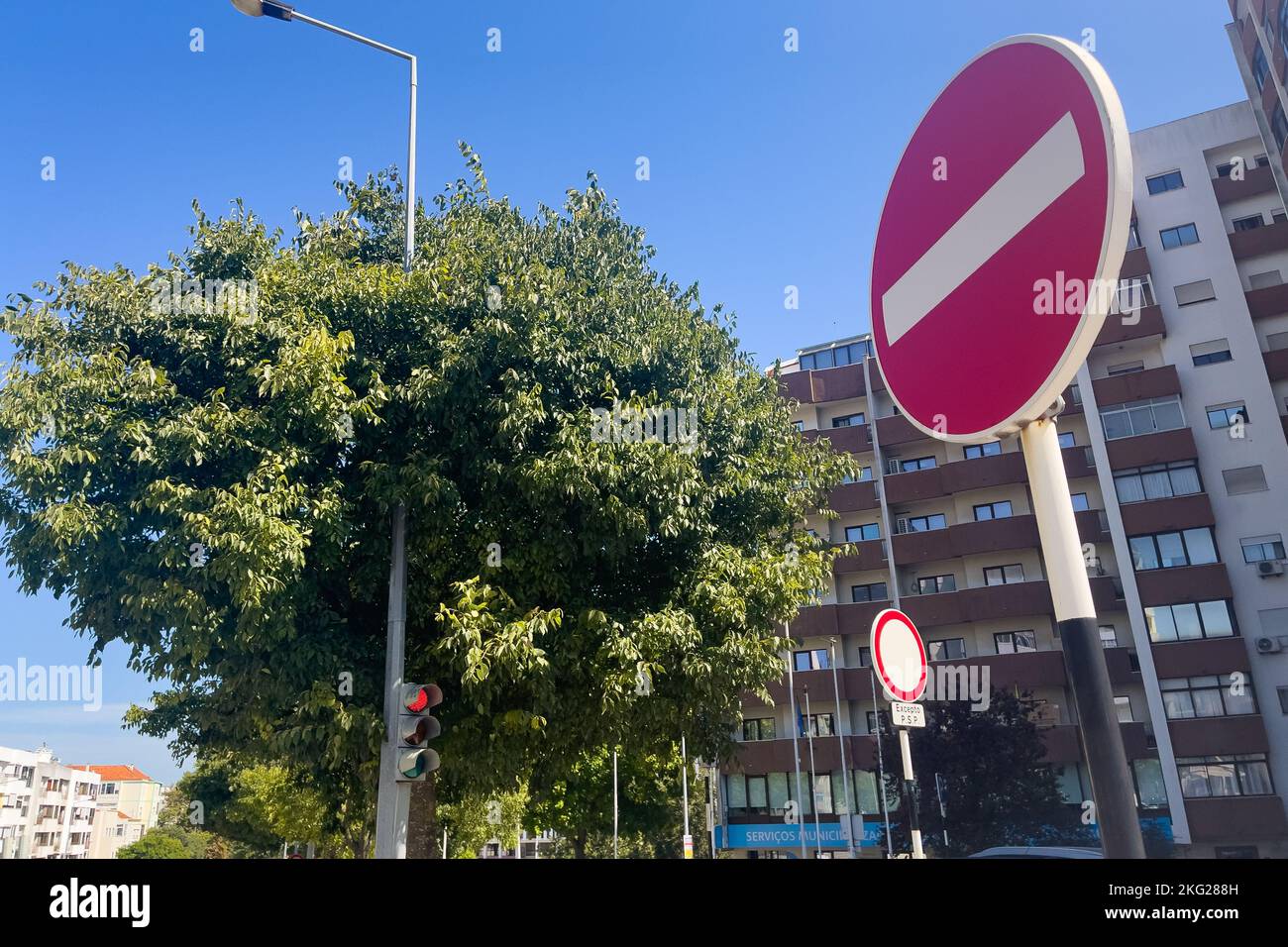 One-way restriction signpost in with residential buildings Stock Photo ...