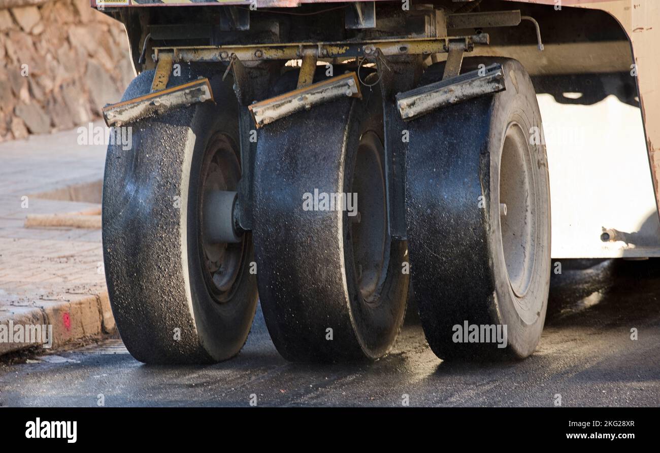 Road construction equipment coating asphalt black top lane Stock Photo ...