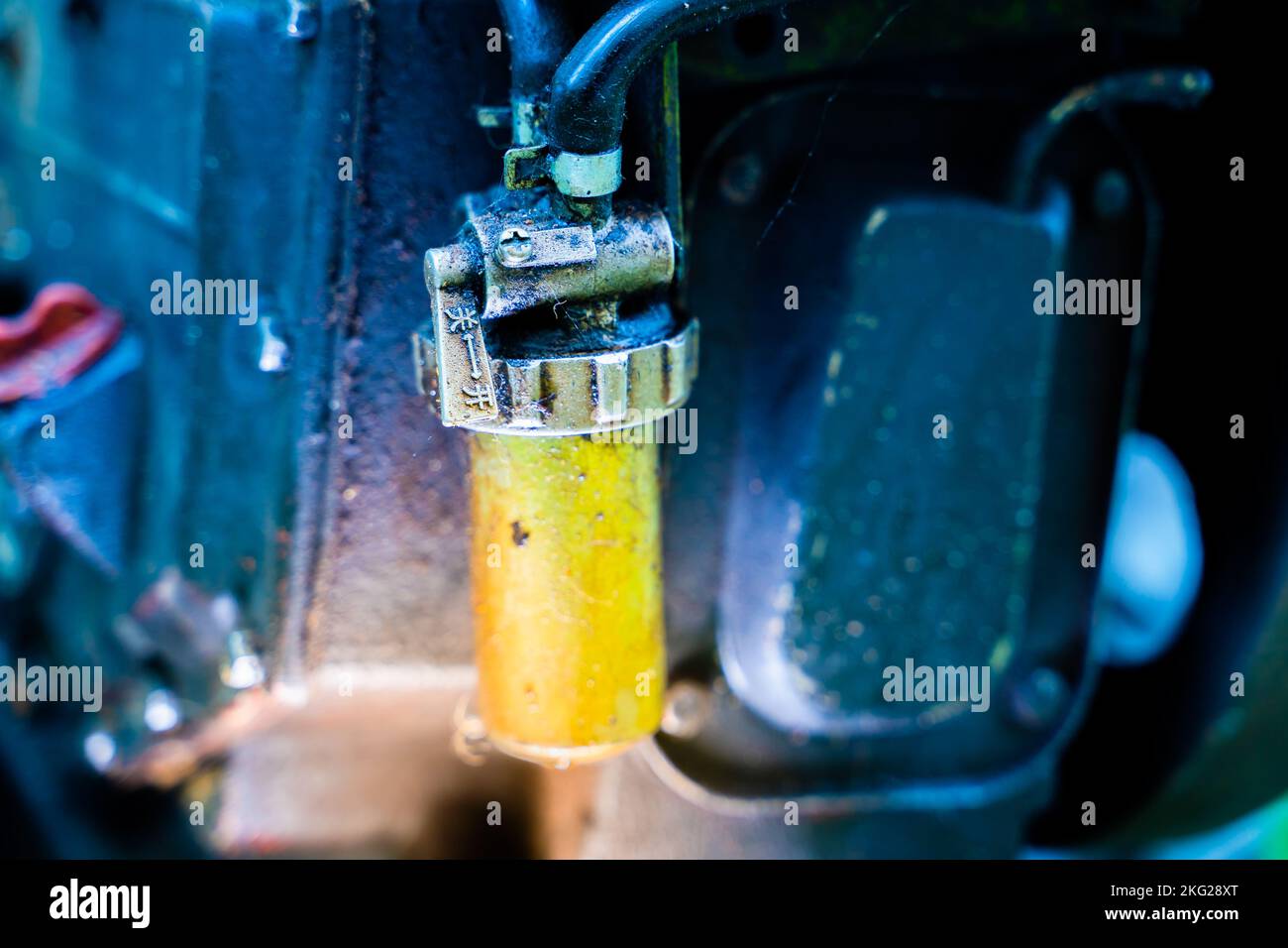 Filter for diesel fuel on the body of a walk-behind tractor close-up ...