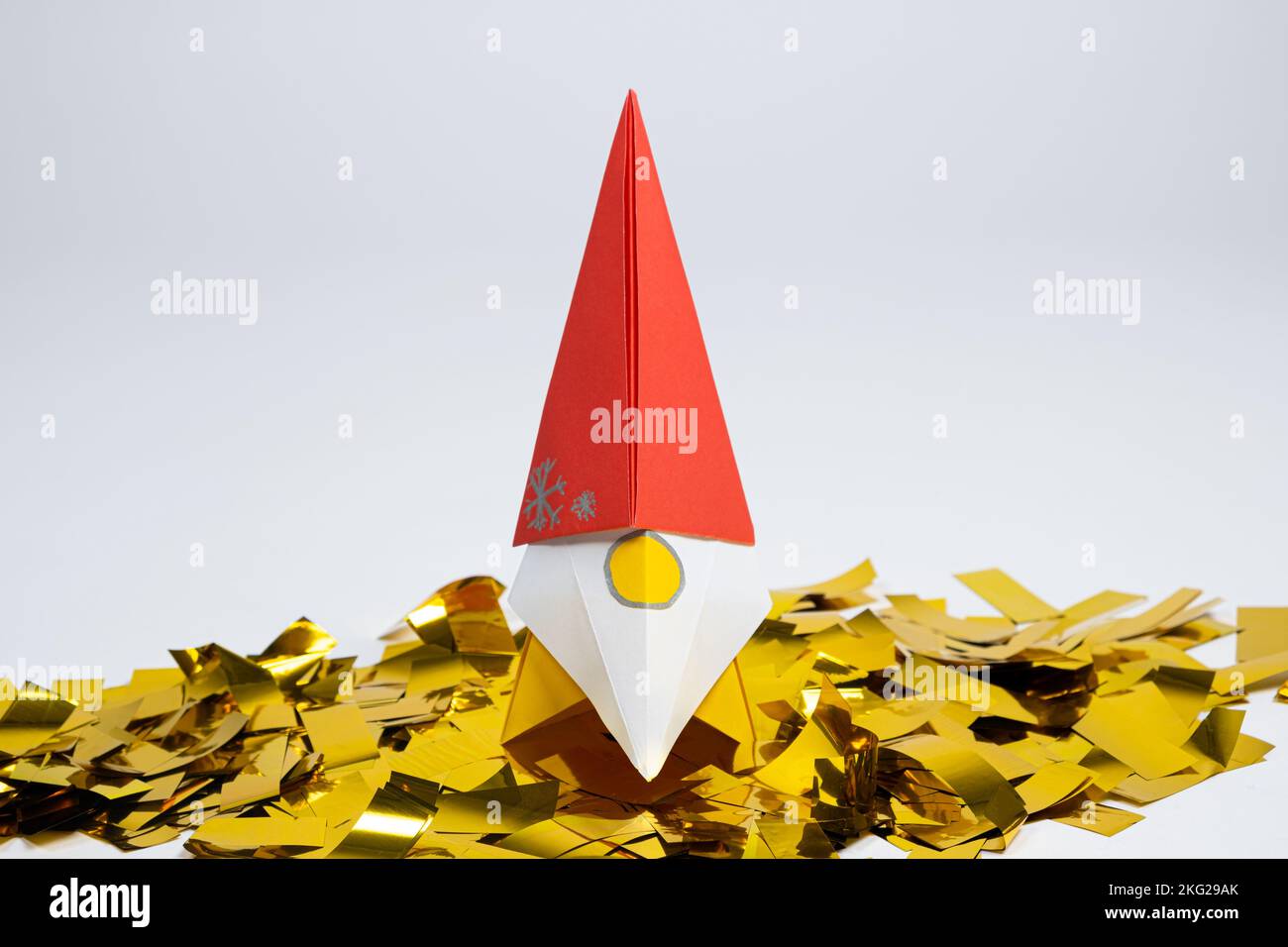 Christmas origami gnome paper on a white background, DIY for the New ...