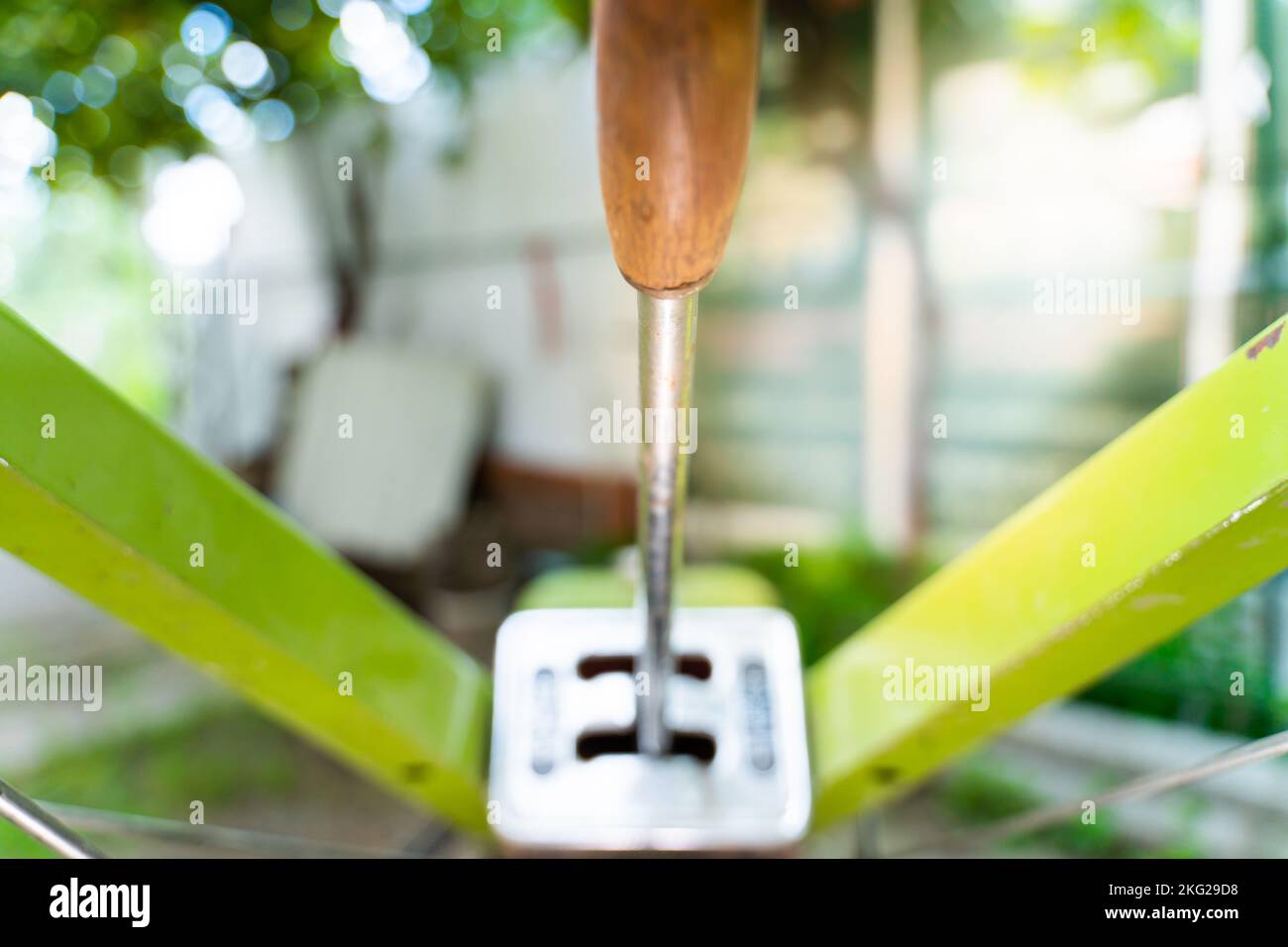 Gear lever on a walk-behind tractor close-up on a blurred background ...
