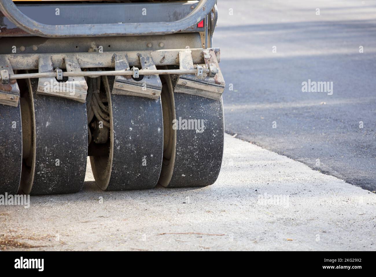 Road construction equipment coating asphalt black top lane Stock Photo ...