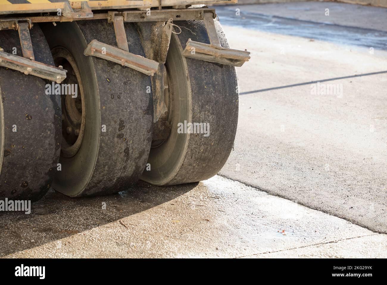 Road construction equipment coating asphalt black top lane Stock Photo ...