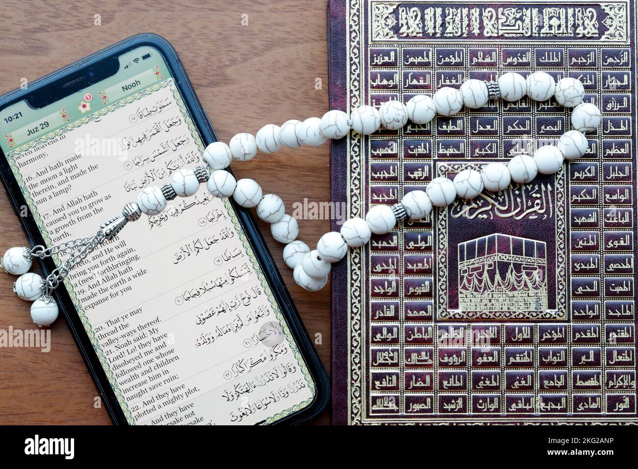 Digital Quran on a tablet and traditional Holy Quran on paper Stock Photo - Alamy