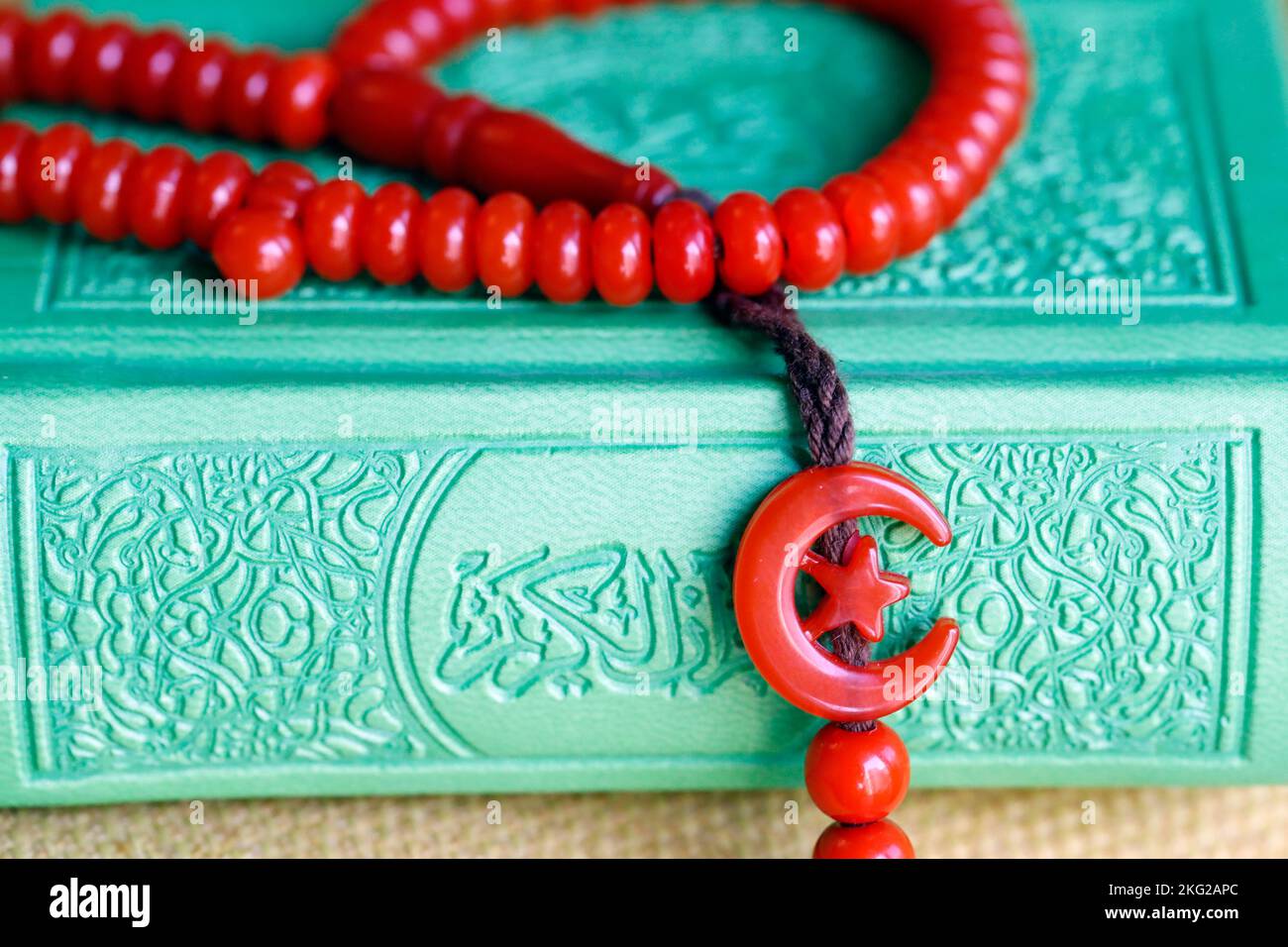 Holy Quran in Arabic and muslim prayer beads. Islam symbols Stock Photo ...