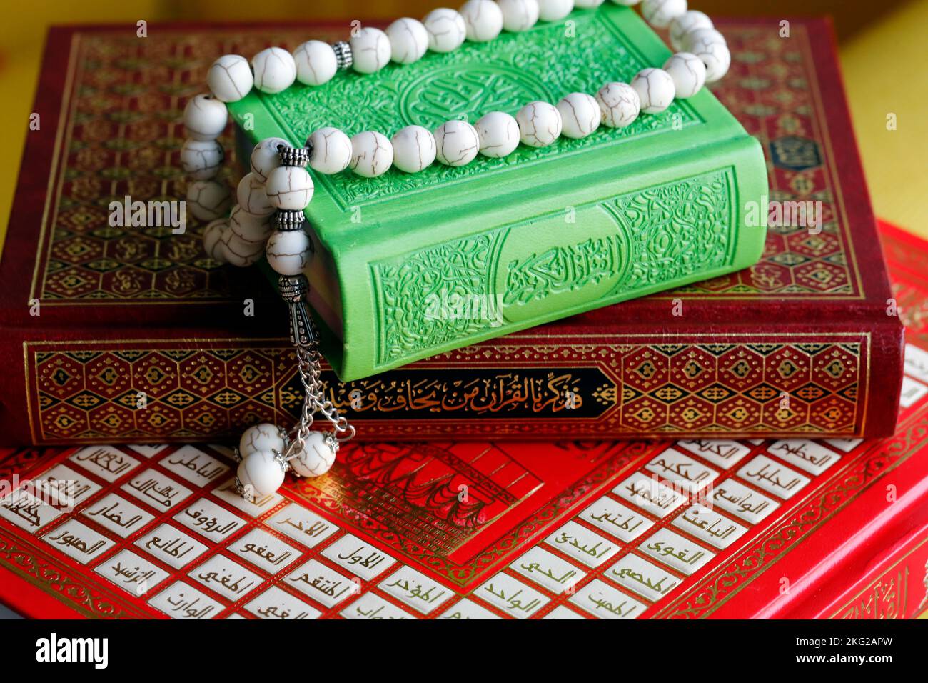 Holy Quran in Arabic and muslim prayer beads. Islam symbols Stock Photo ...