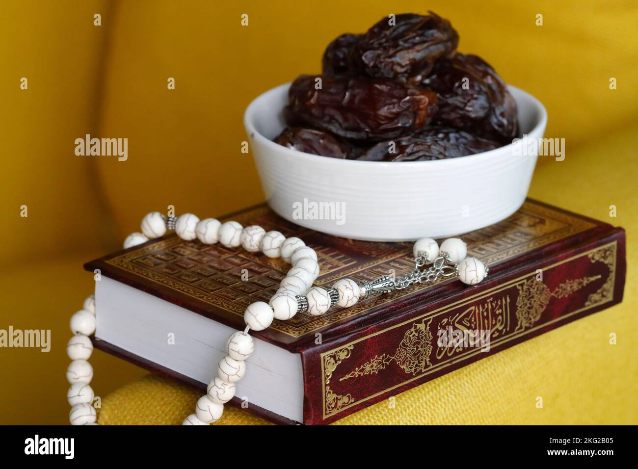 Holy Quran in arabic, muslim prayer beads, and fresh dates. Islam ...
