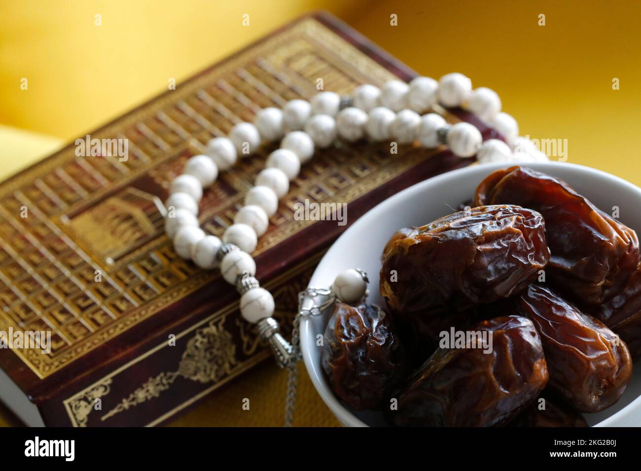 Holy Quran in arabic, muslim prayer beads, and fresh dates. Islam ...