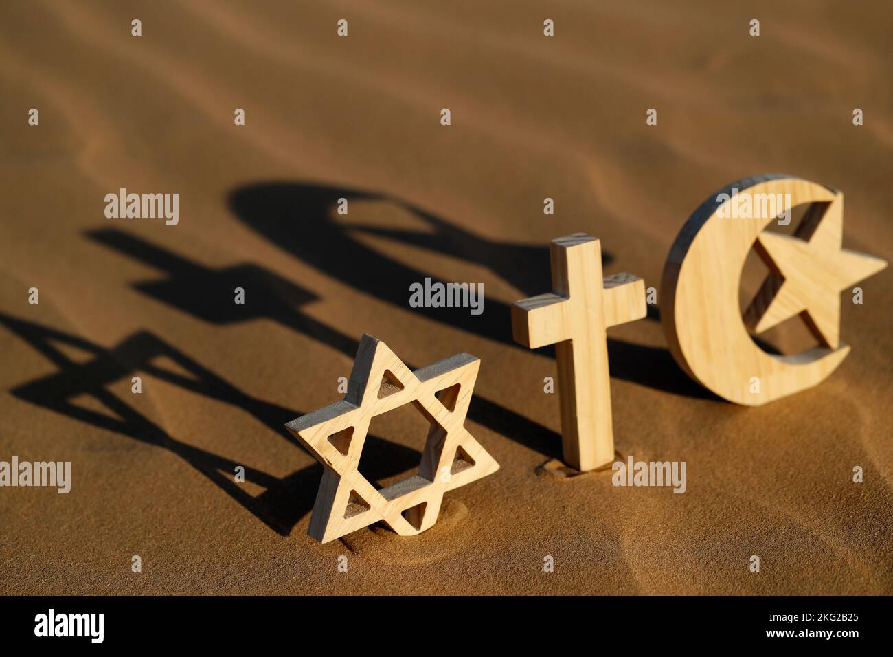 Religious symbols on sand at sunset : Jewish Star of David, Muslim Star ...