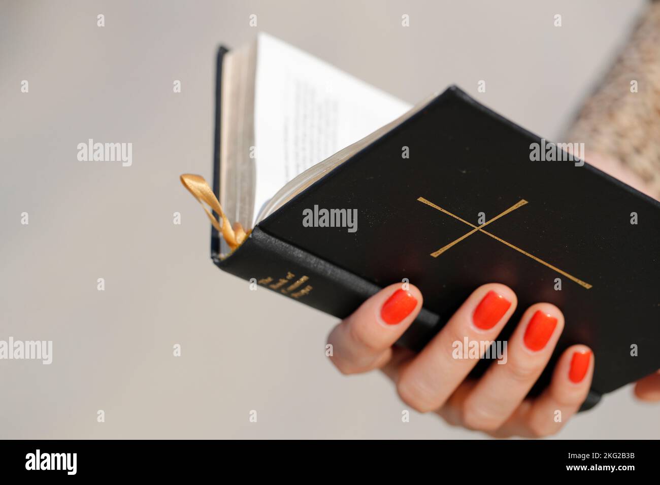 Christian woman reading the bible outside. Close up on hands. Concept ...