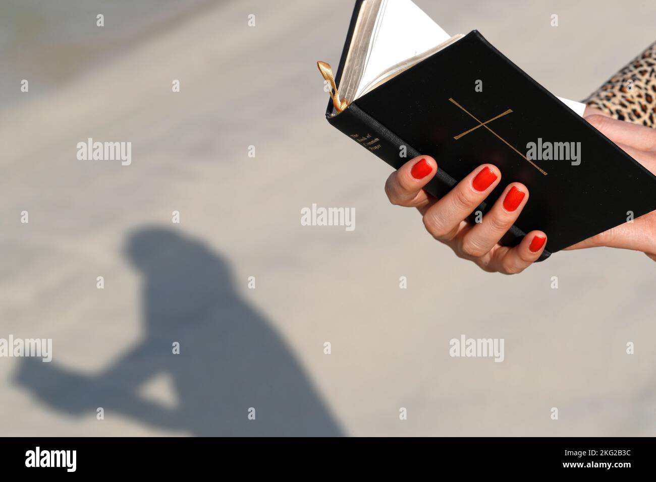 Christian woman reading the bible outside. Close up on hands. Concept ...