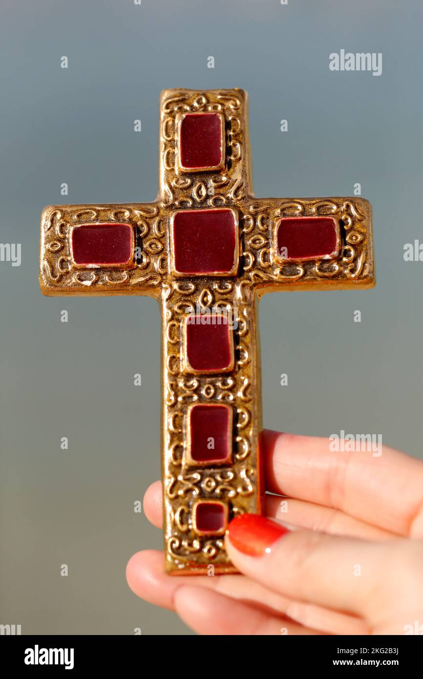 Christian woman holding a christian cross. Close up on hands. Concept ...