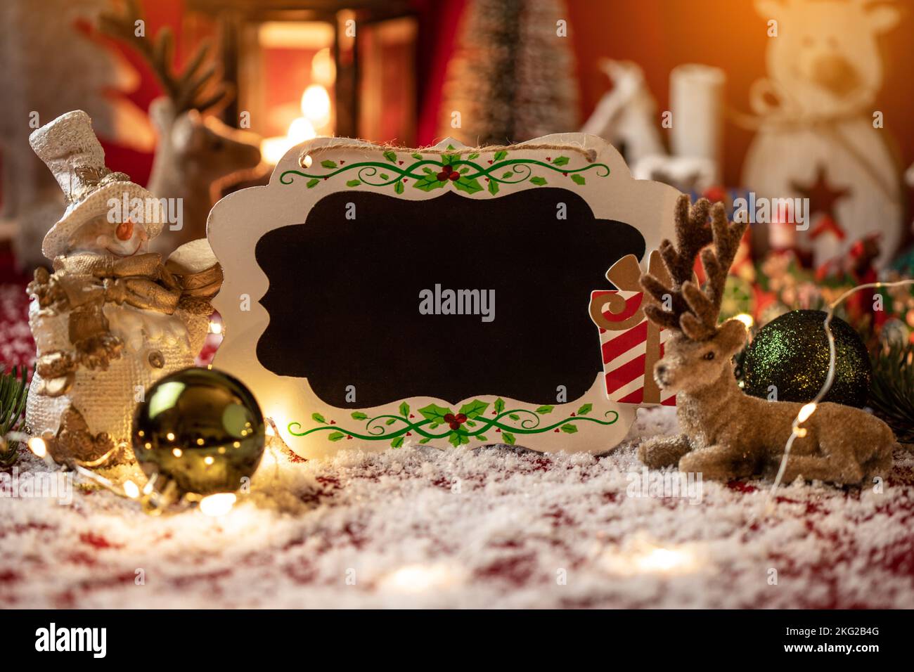 A Christmas board with copy space surrounded by Christmas decorations ...
