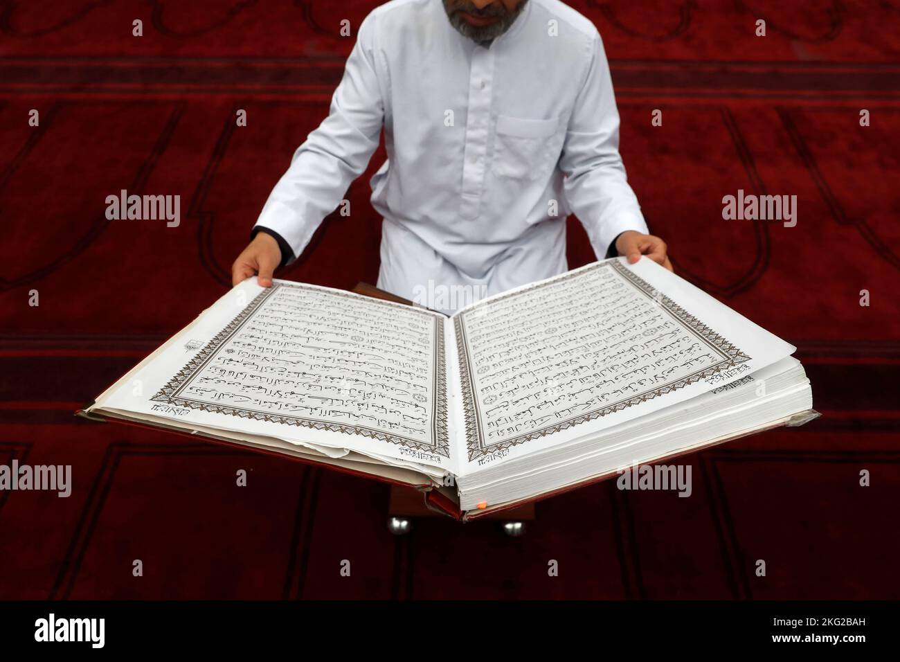 Muslim reading the Holy Quran in a mosque Stock Photo - Alamy