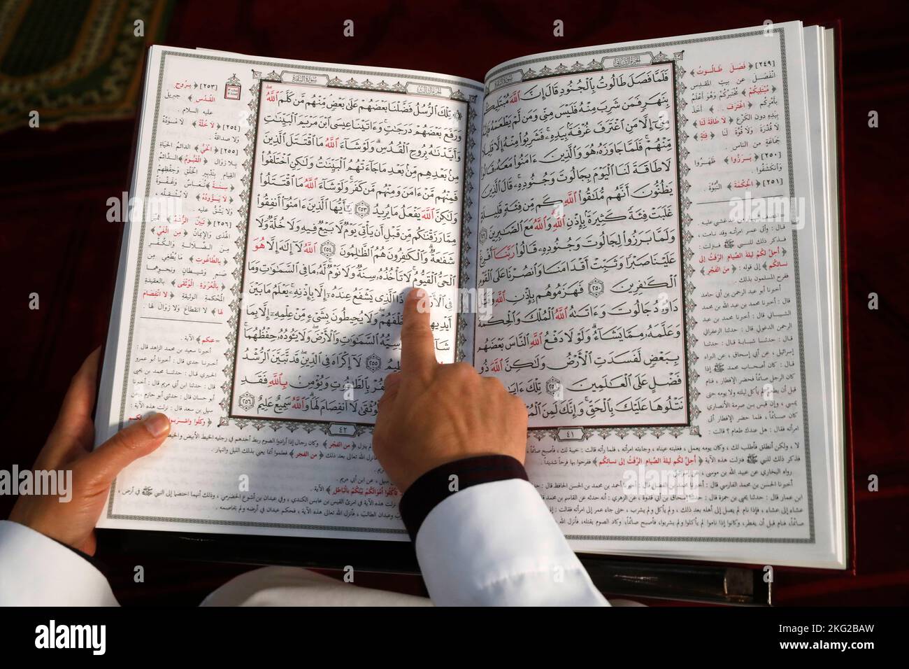 Muslim reading the Holy Quran in a mosque Stock Photo - Alamy