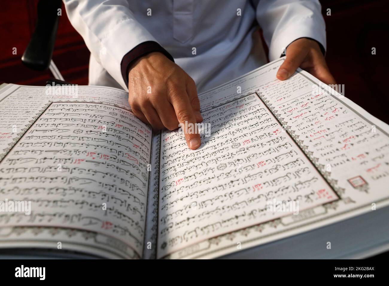 Muslim reading the Holy Quran in a mosque Stock Photo - Alamy