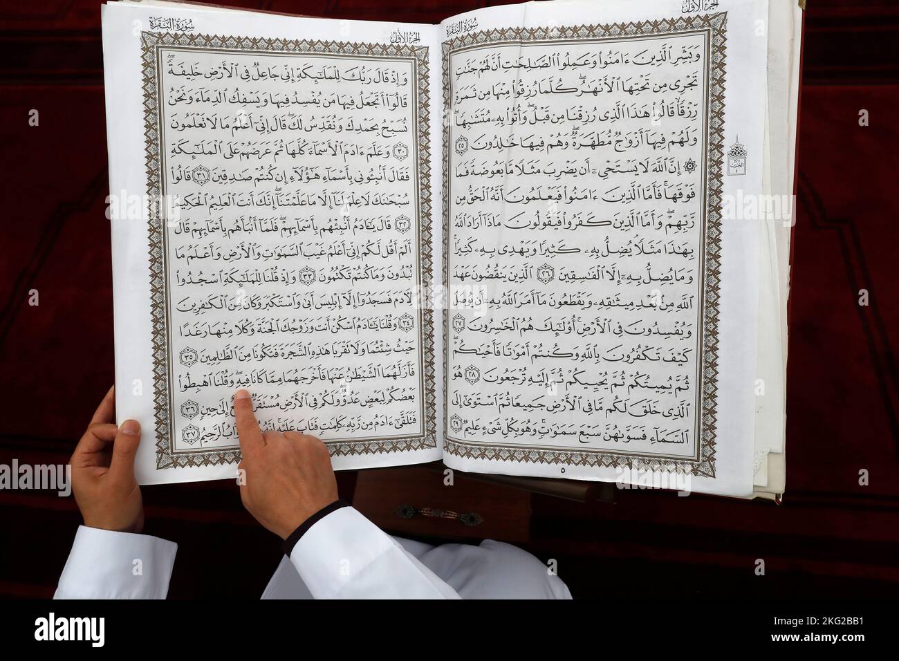 Muslim reading the Holy Quran in a mosque Stock Photo - Alamy