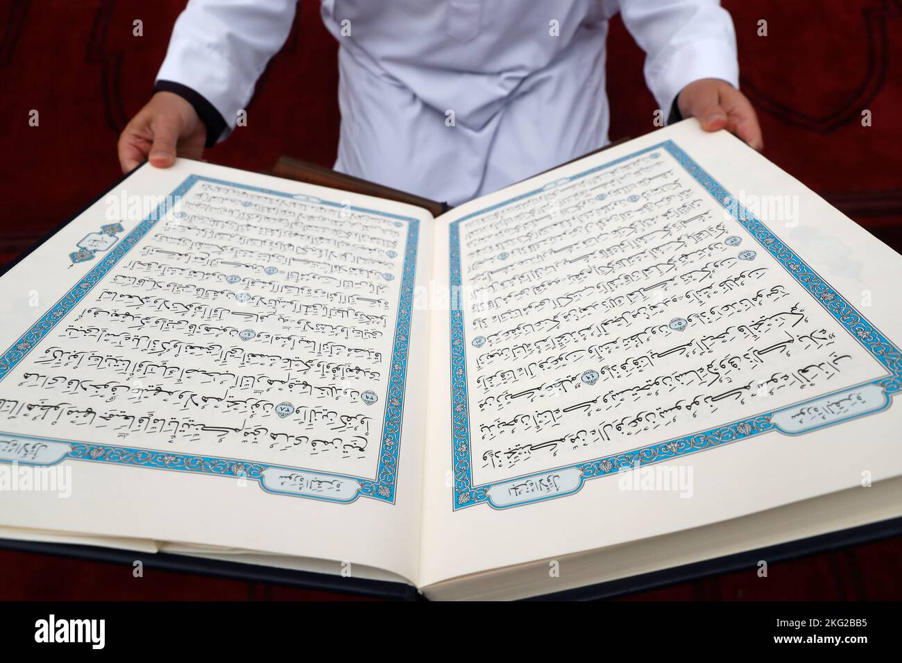 Muslim reading the Holy Quran in a mosque Stock Photo - Alamy