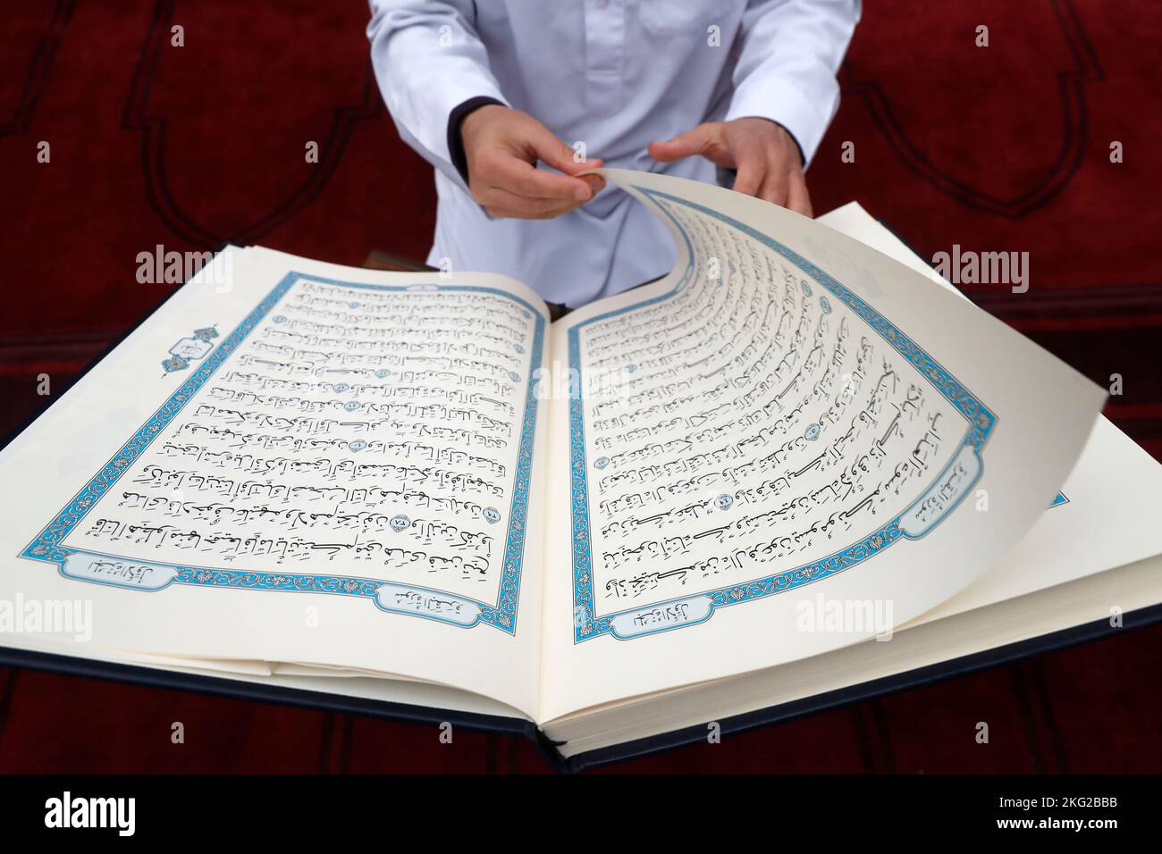 Muslim reading the Holy Quran in a mosque Stock Photo - Alamy