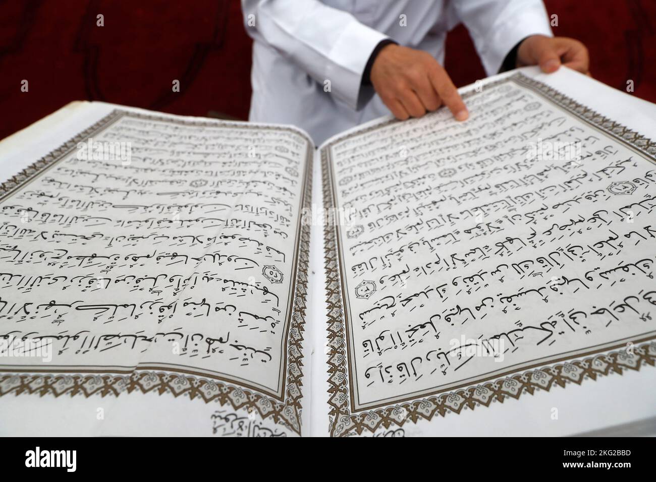 Muslim reading the Holy Quran in a mosque Stock Photo - Alamy
