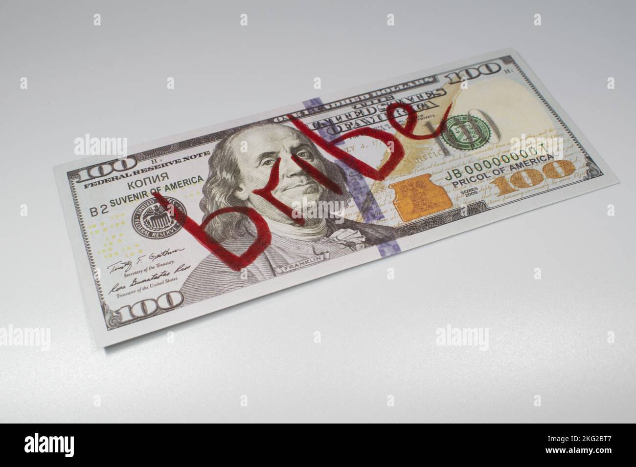 The inscription or label on the bribe on a hundred dollar bill on a ...