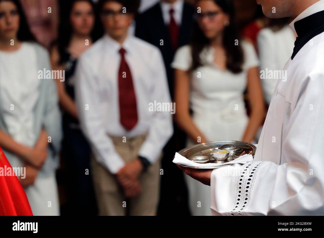 Roman catholic confirmation ceremony in church. Oil of Catechumens ...