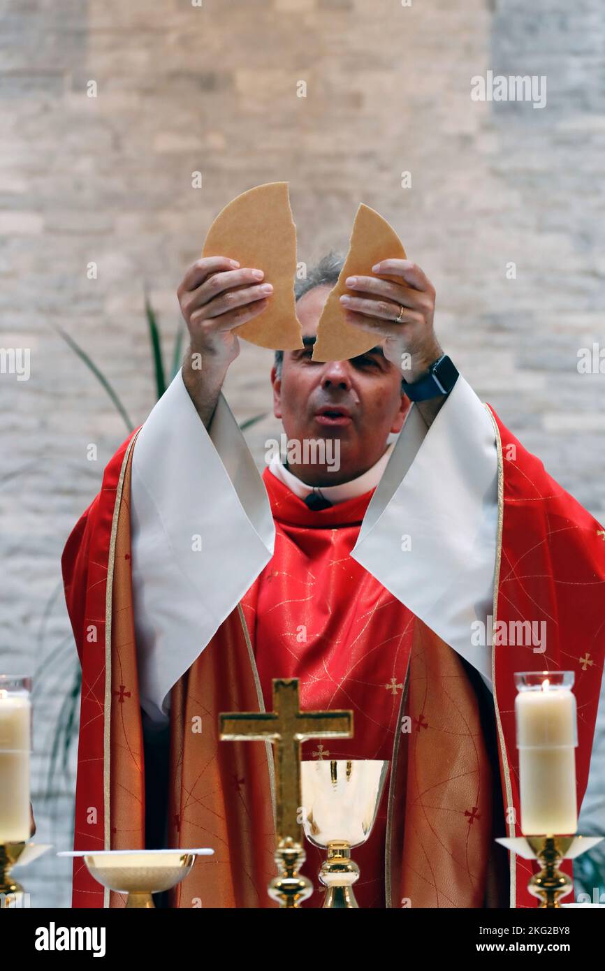 Sainte Claire church. Catholic mass. Eucharistic celebration. Priest ...