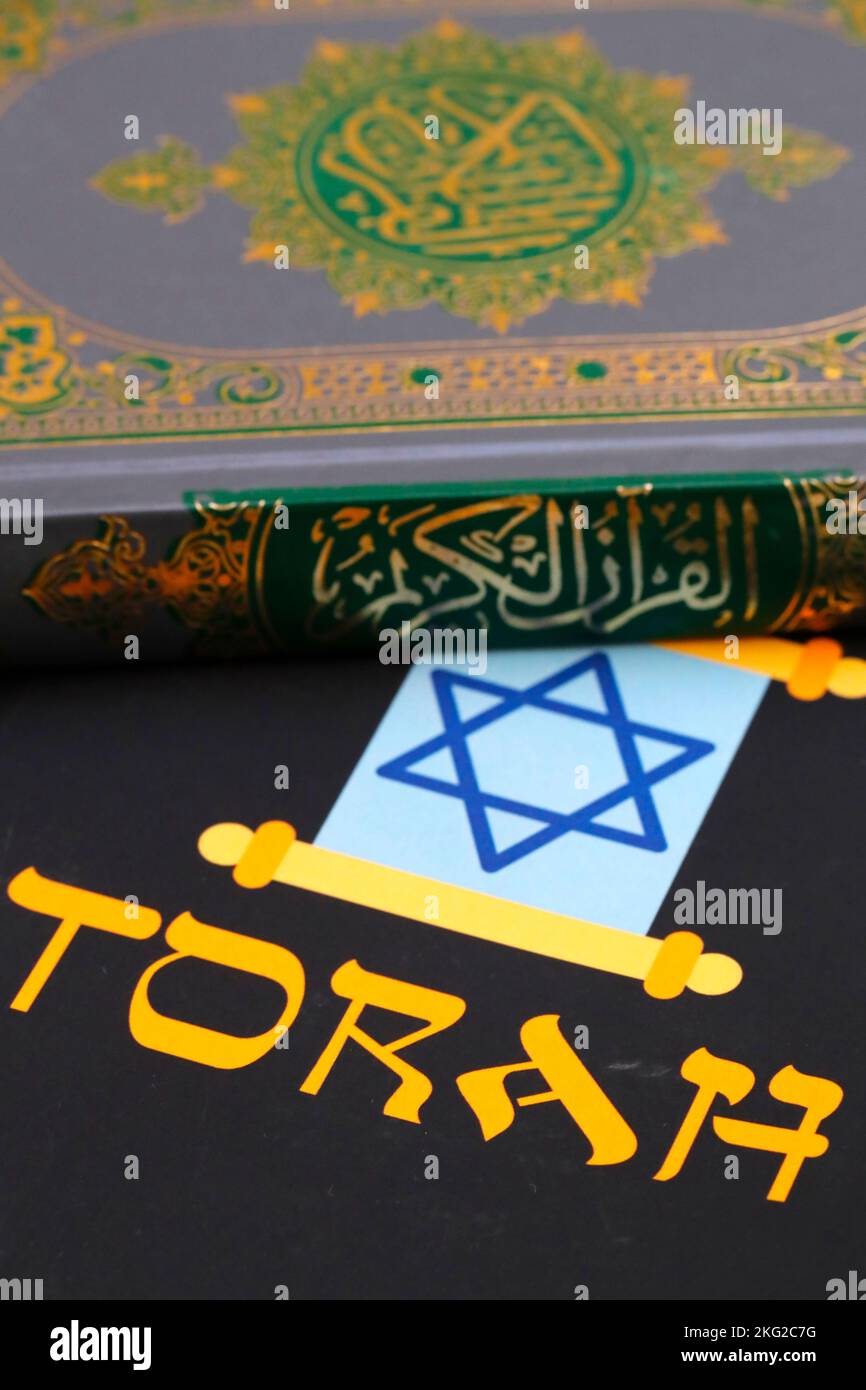 Religious symbols : Muslim Holy Quran, and Jewish Torah. Interreligious ...