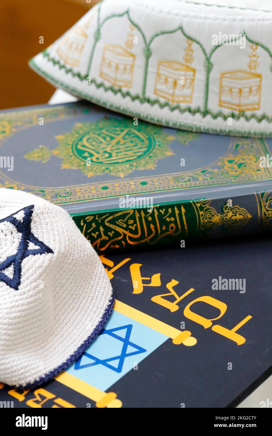 Religious symbols : Muslim Kufi cap with Quran, and Jewish Kippah with ...