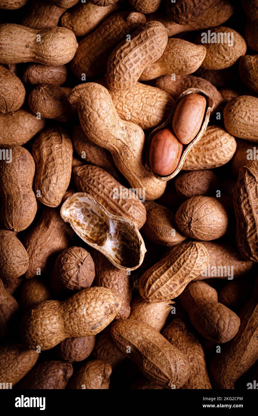 open peanut between peanuts Stock Photo - Alamy