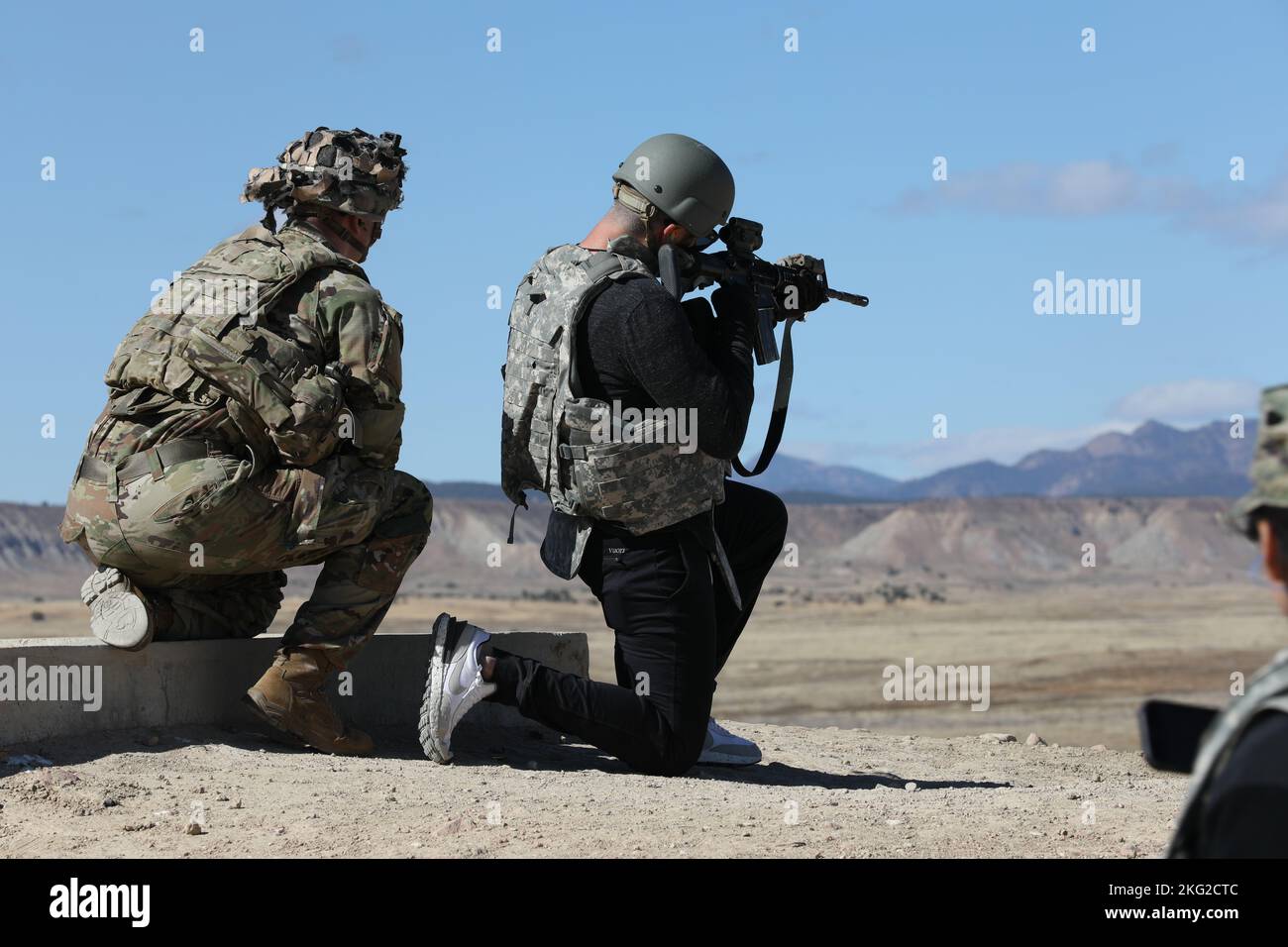 A civilian participant fires an M4 Carbine rifle during the Joint ...